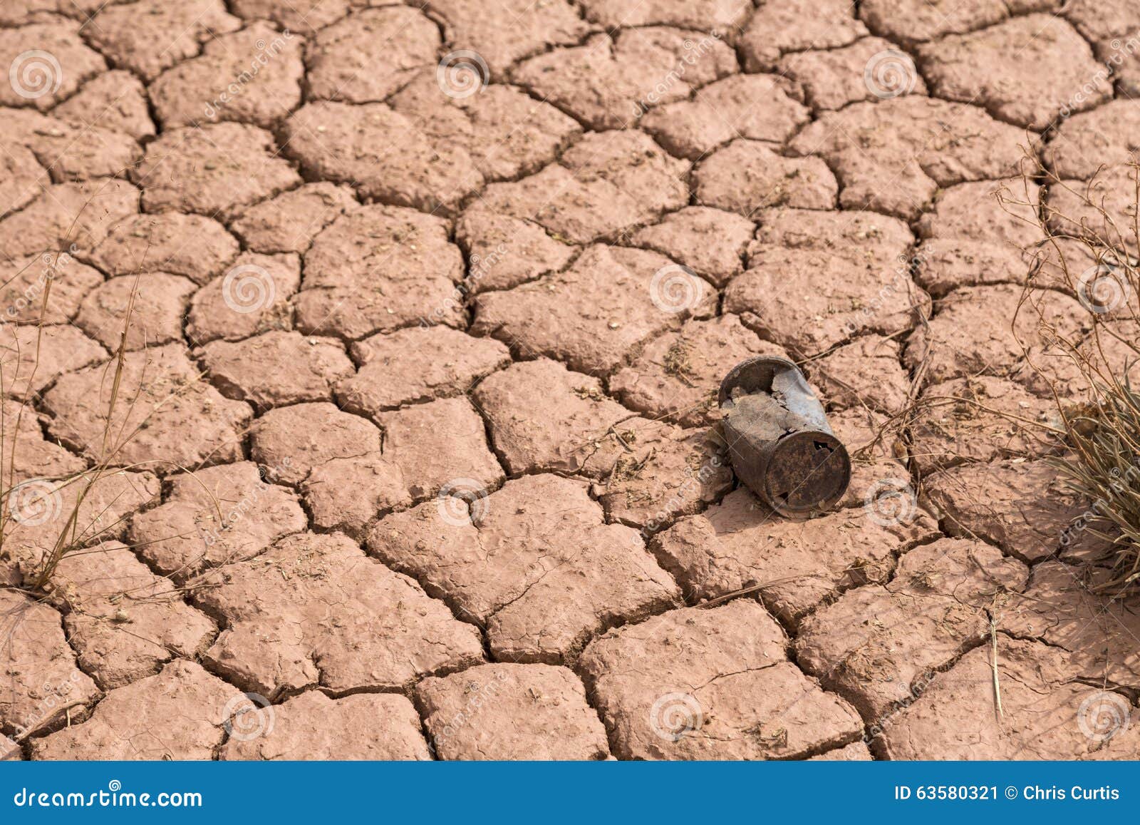 Dry Red Cracked Mud and Discarded Tin Can Stock Image - Image of damage ...