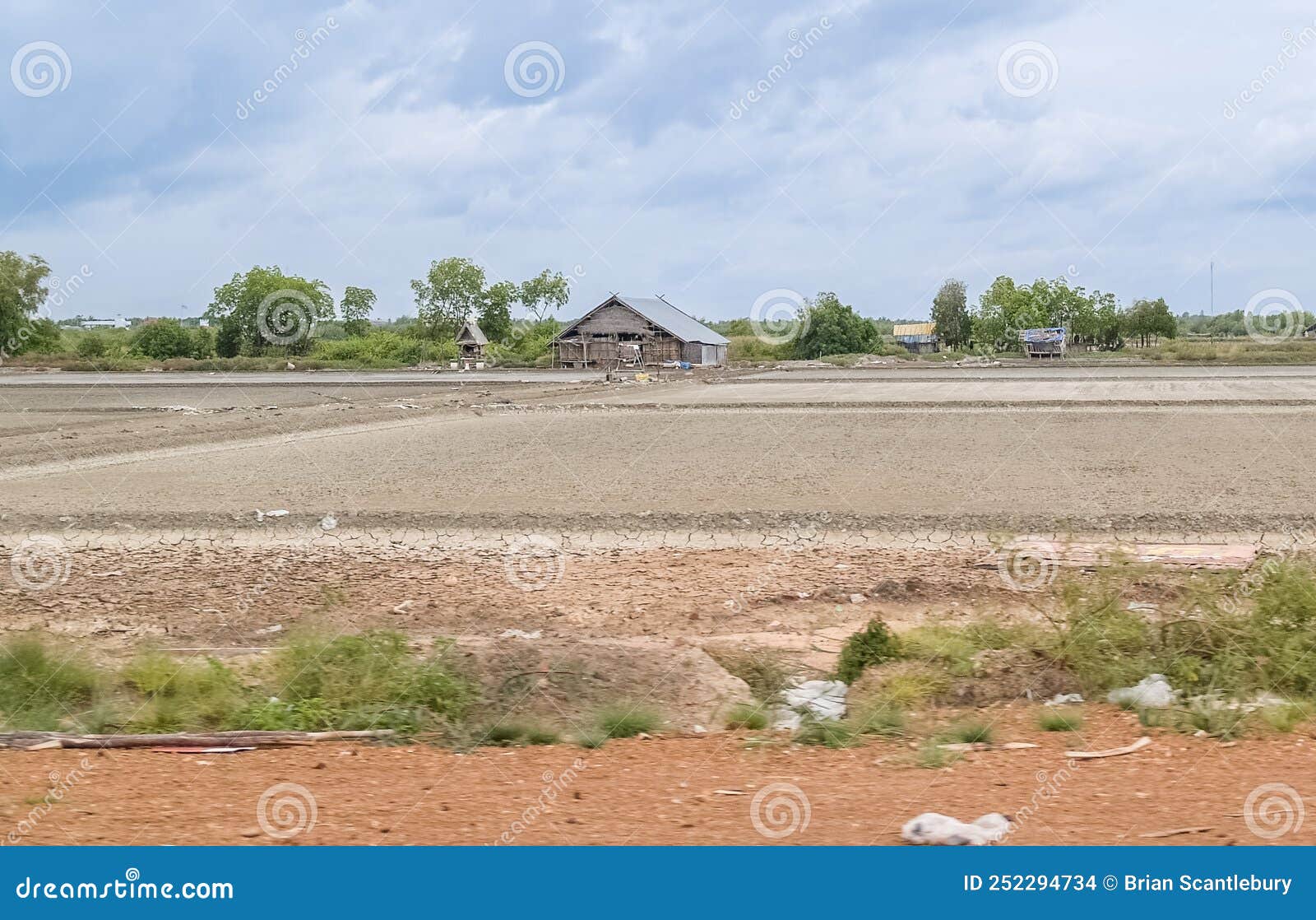 Dry Rice Paddy Fields and Old Shack in Rural Thailand Stock Photo ...