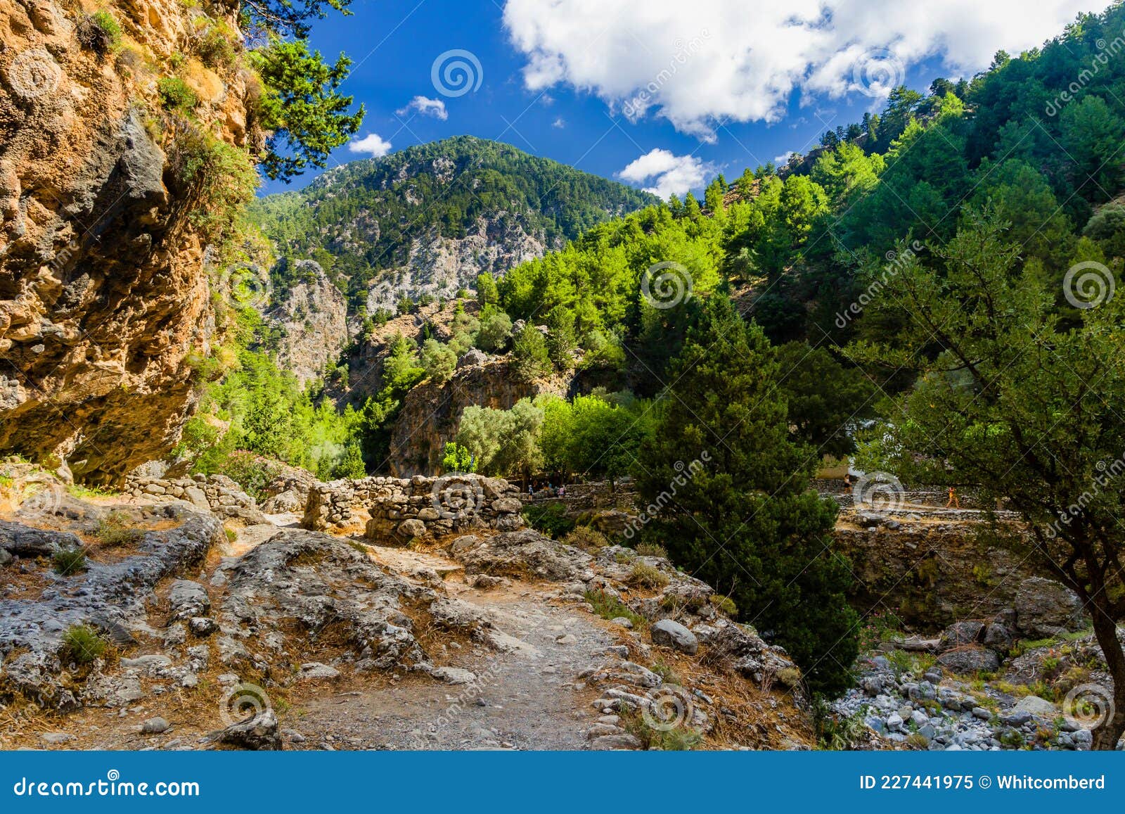 Dry Riverbed And Towering Cliffs In A Huge Natural Gorge Samaria Gorge ...