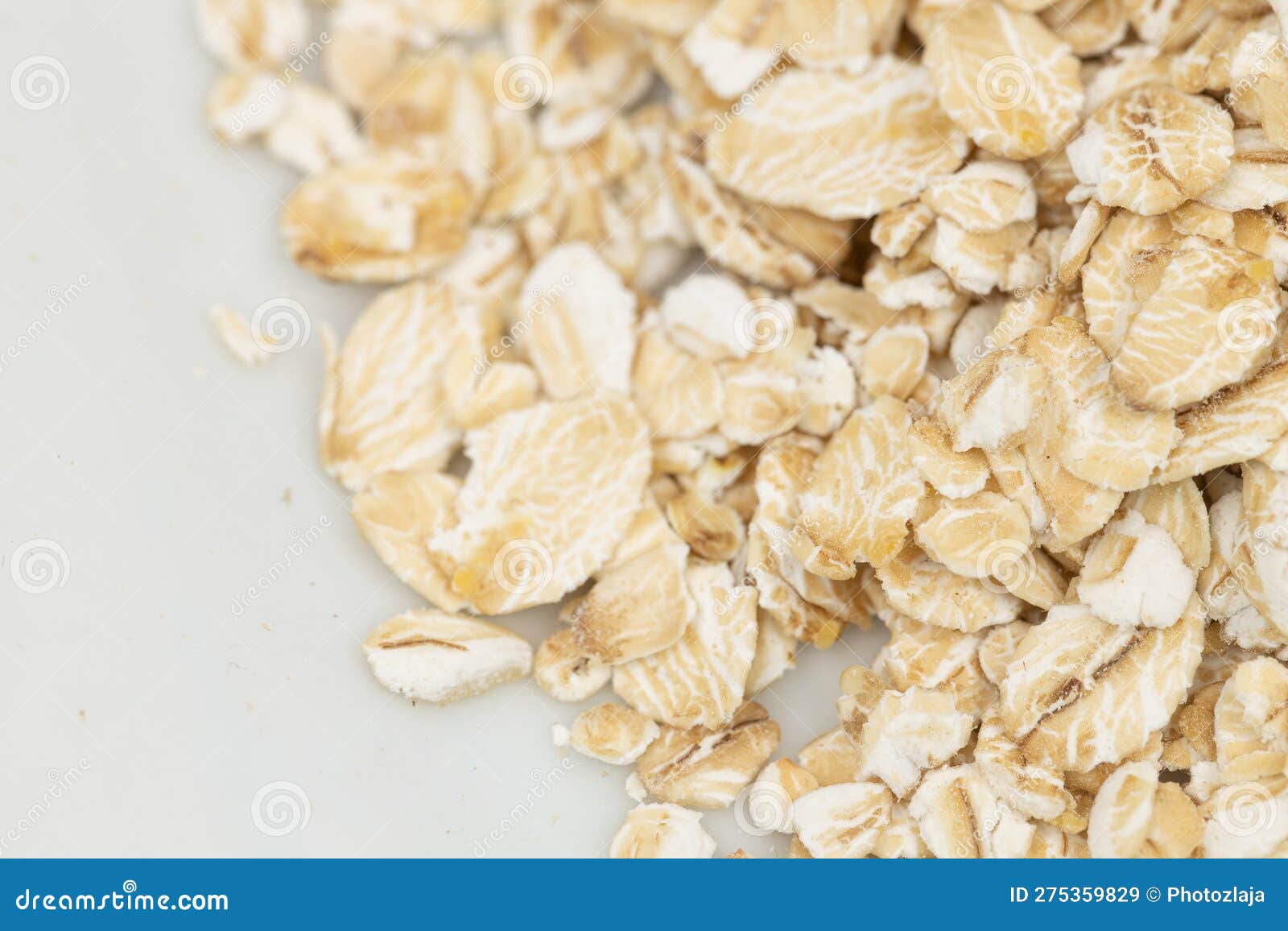 Dry Rolled Oatmeal in Bowl Isolated on White Background. Top View Stock ...