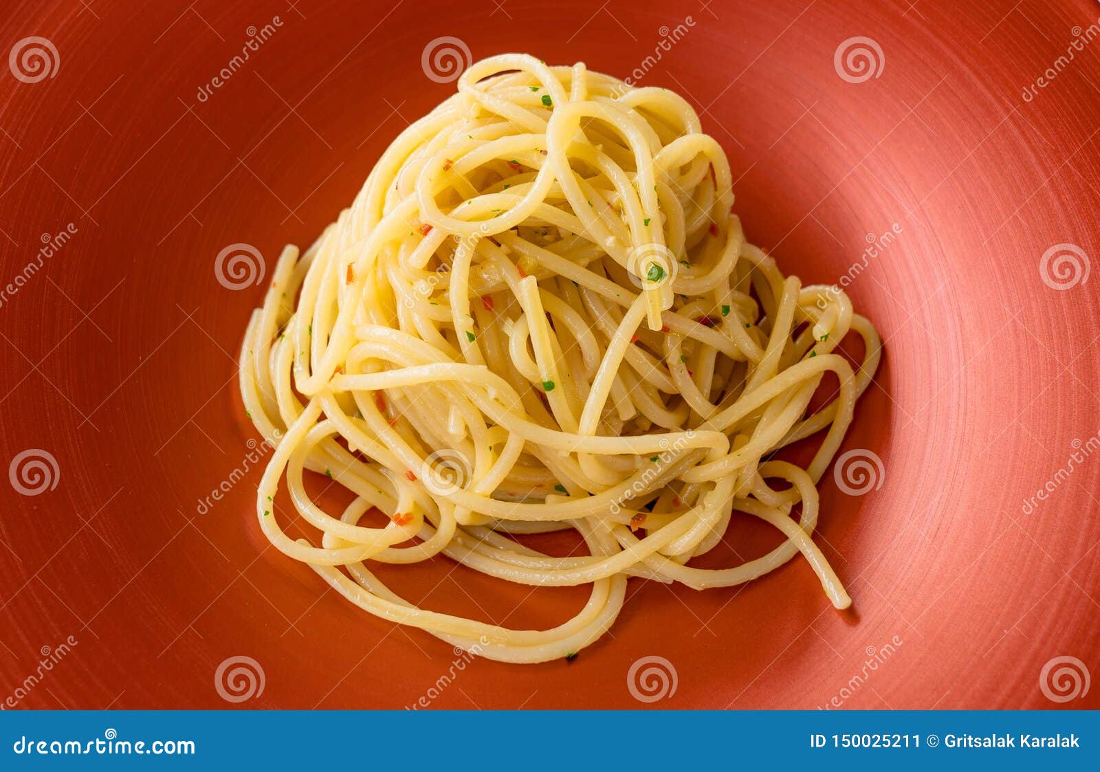 Dry spaghetti in red plate stock image. Image of noodles - 150025211