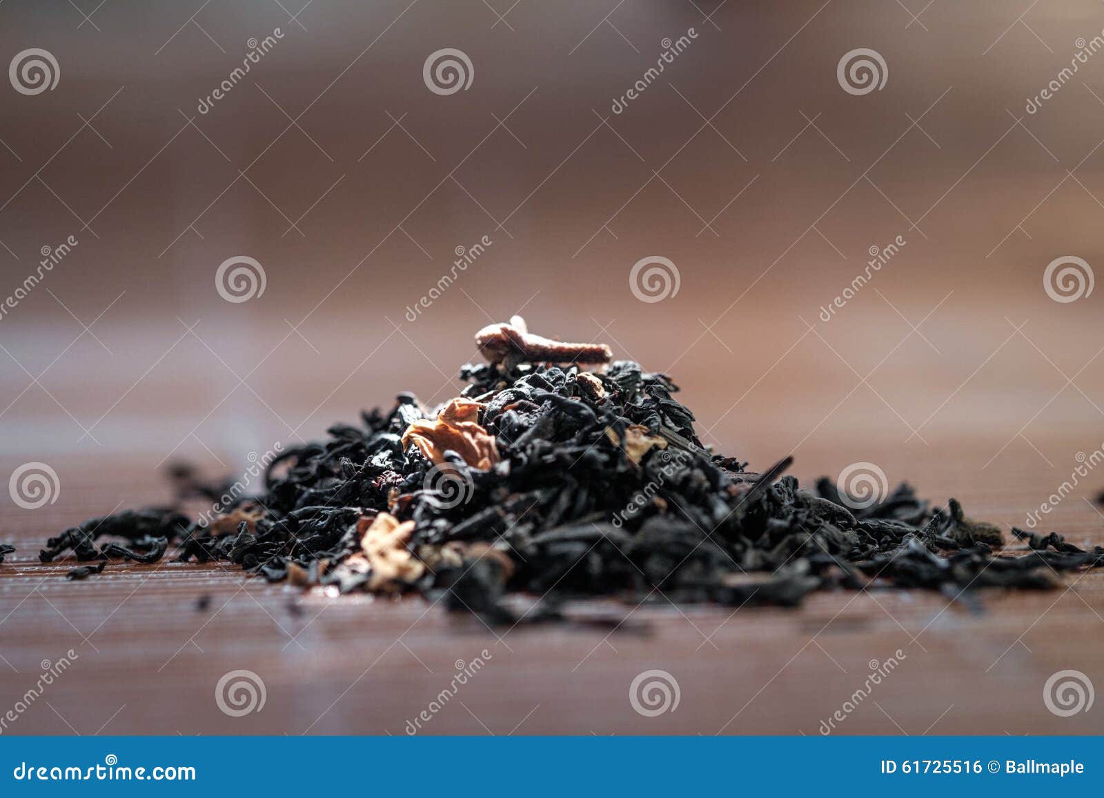 Dry Tea Leaves Spread on Light Brown Color Background Stock Photo ...