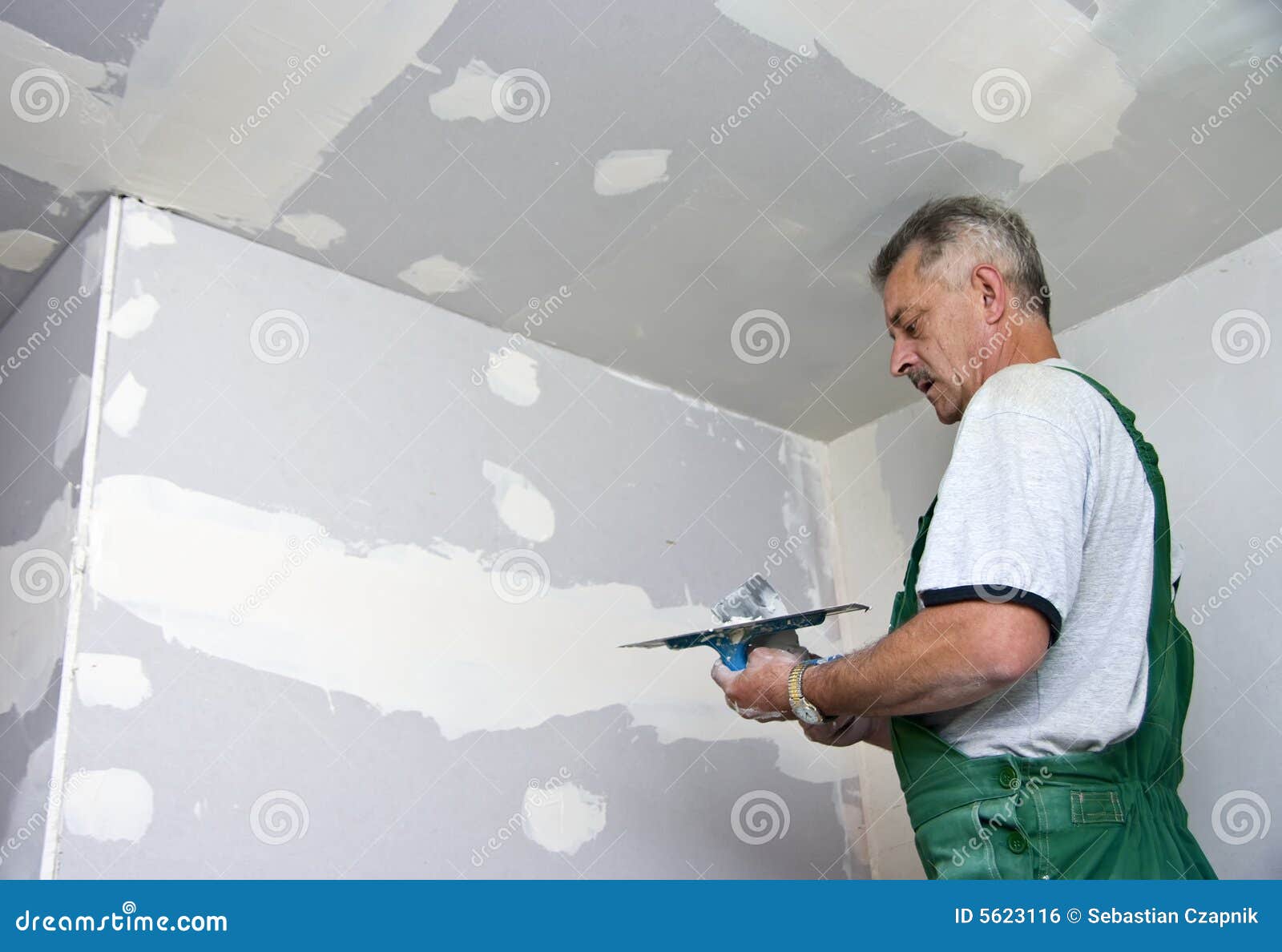 Dry waller at work stock photo. Image of drywall, hall - 5623116