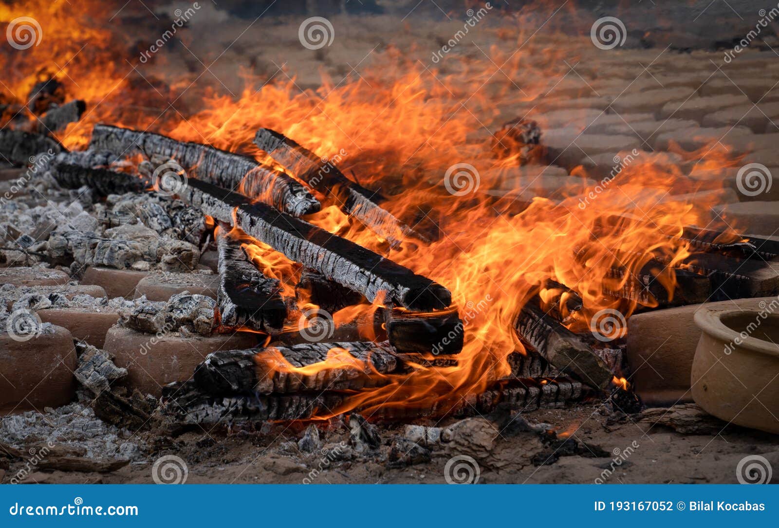 Drying clay pots on fire stock photo. Image of people - 193167052