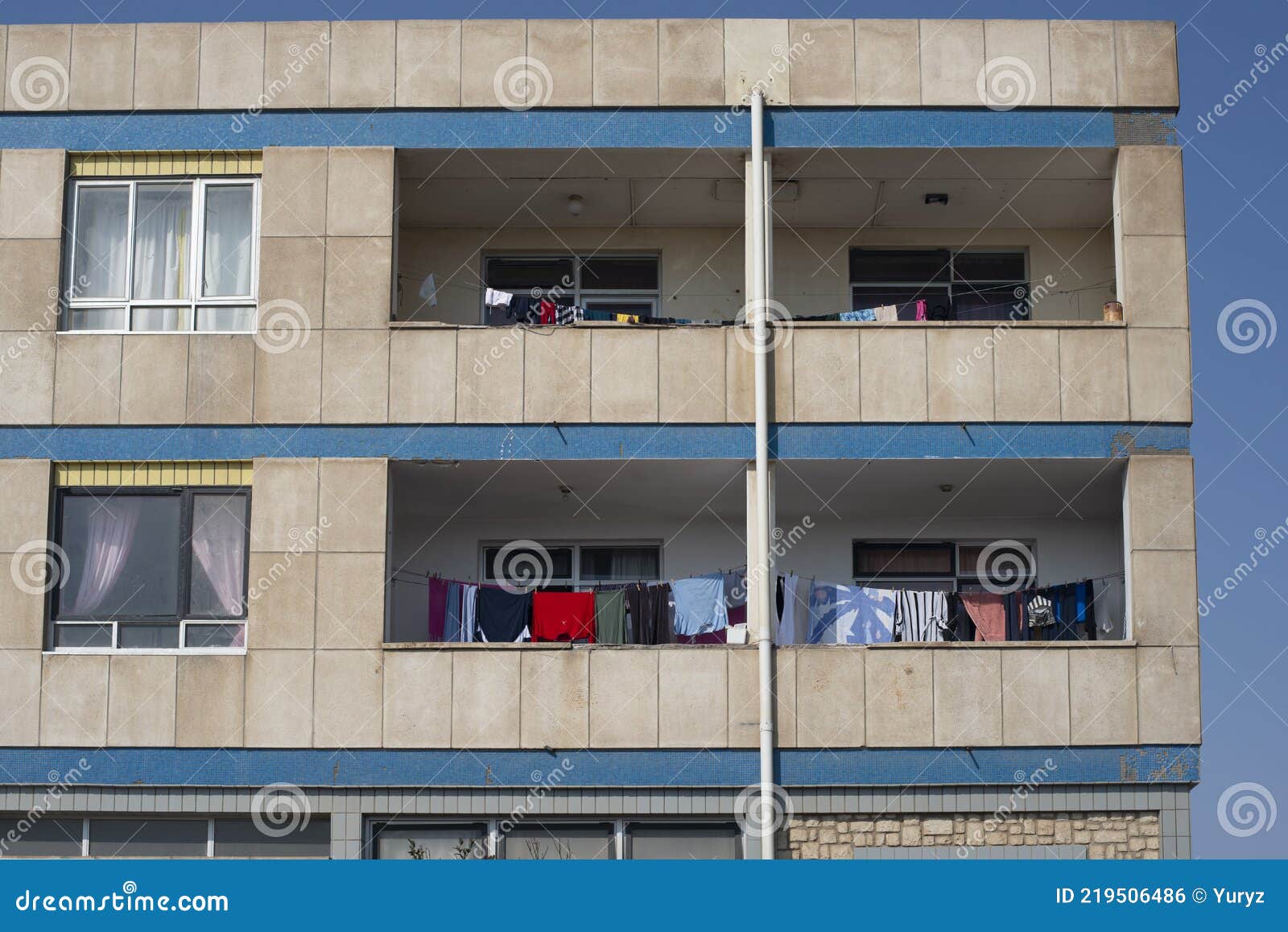 Drying clothes on balcony stock photo. Image of window - 219506486