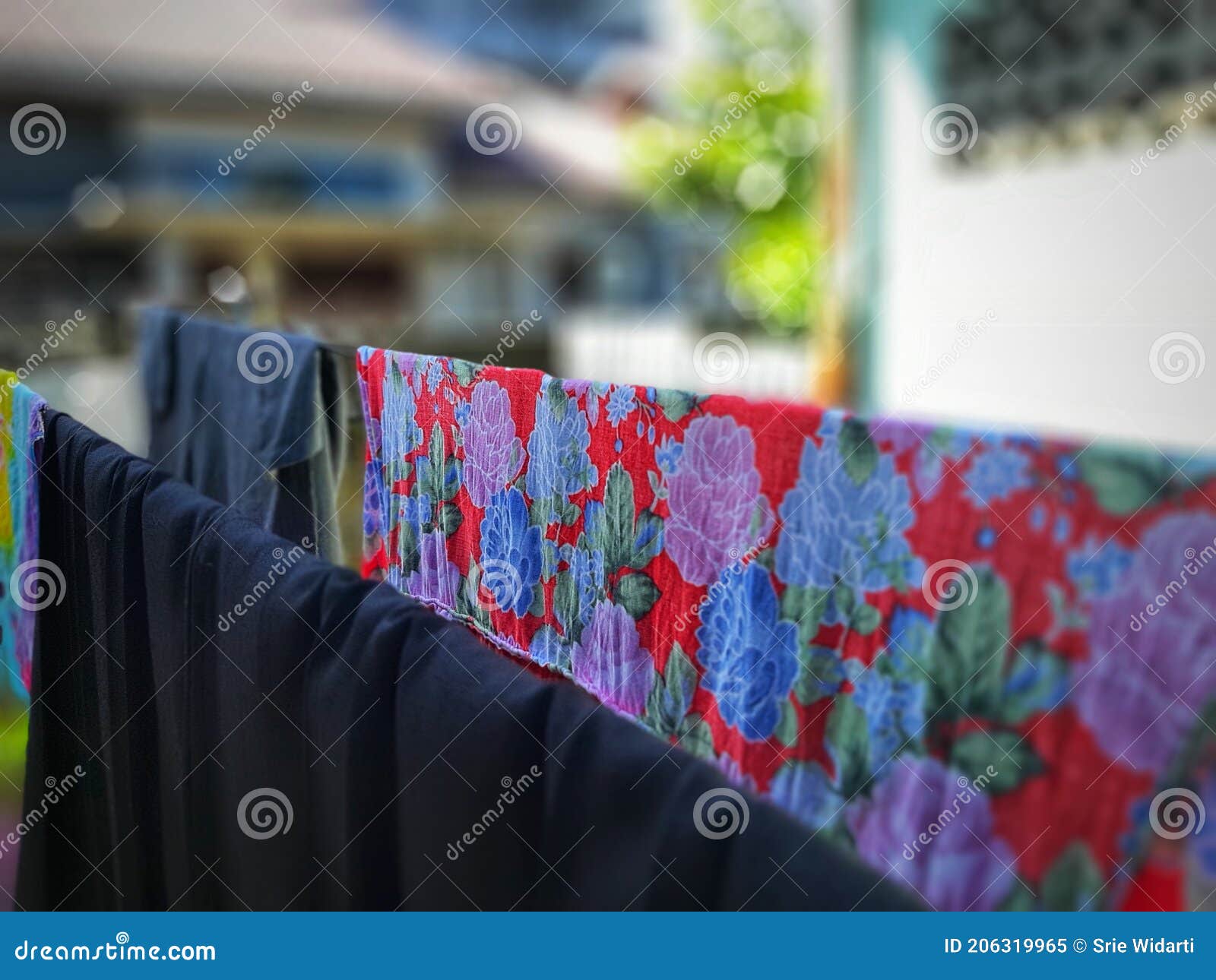 Drying clothes in the sun stock image. Image of flower - 206319965