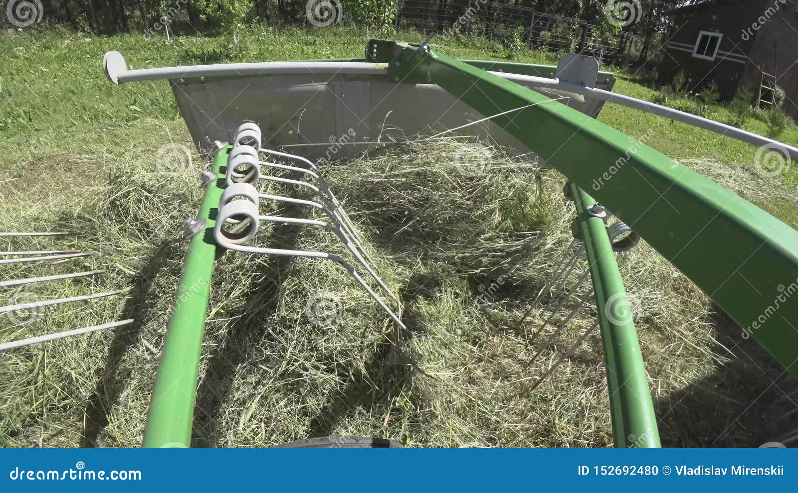 Drying Hay by Turning with a Rotor Tractor Rake Stock Footage - Video ...