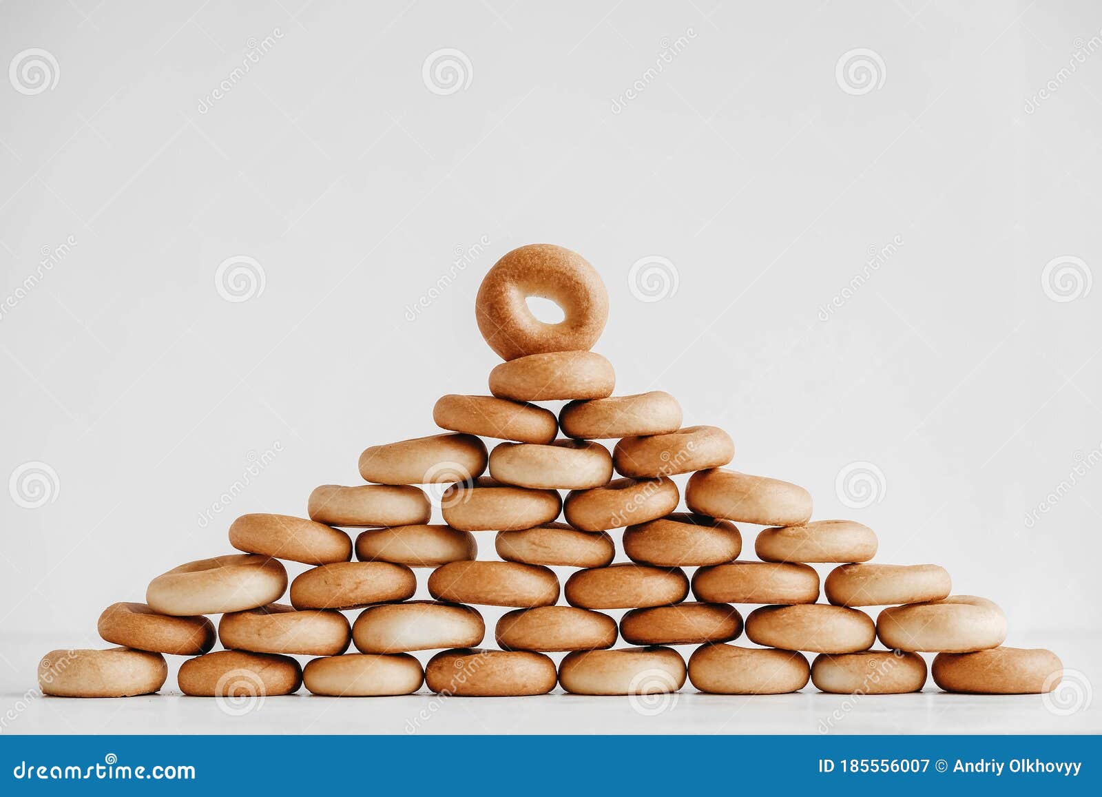 Drying or Mini Round Bagels in the Shape of a Pyramid on a White Wooden ...