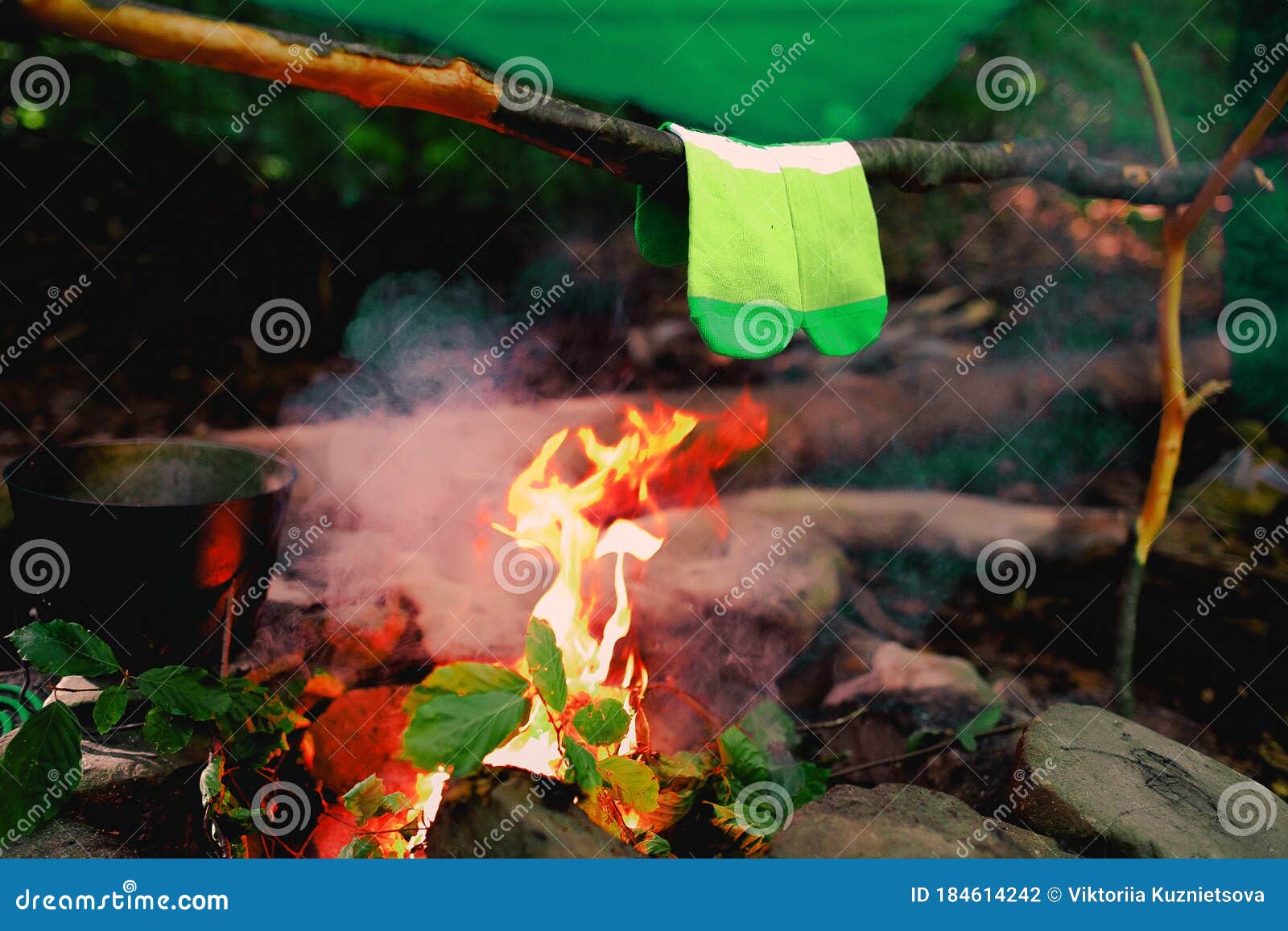 Drying Wet Socks on the Bonfire during Camping. Socks Drying on Fire ...