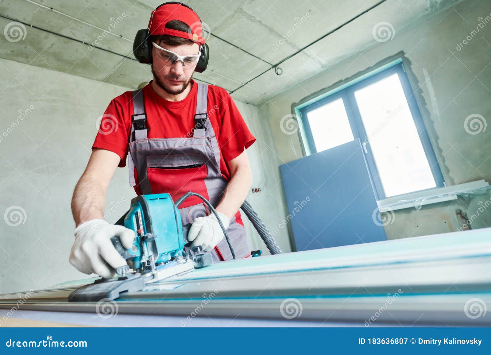 Drywall Construction at Home. Contractor Worker Milling Gypsum ...