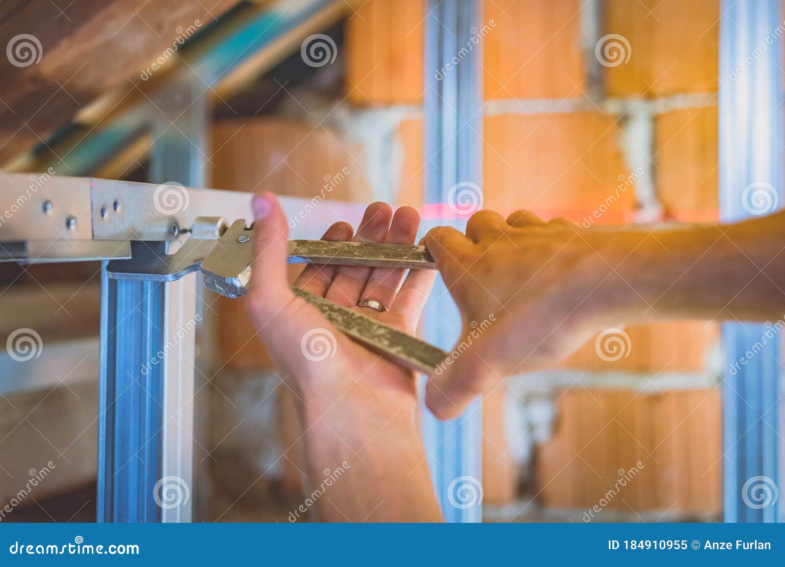 Drywall Plaster Wall Metal Fixation. Man Holding Metal Ruler Against ...