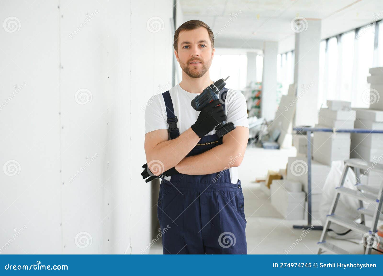 Drywall Worker Works on Building Site in a House. Stock Image - Image ...