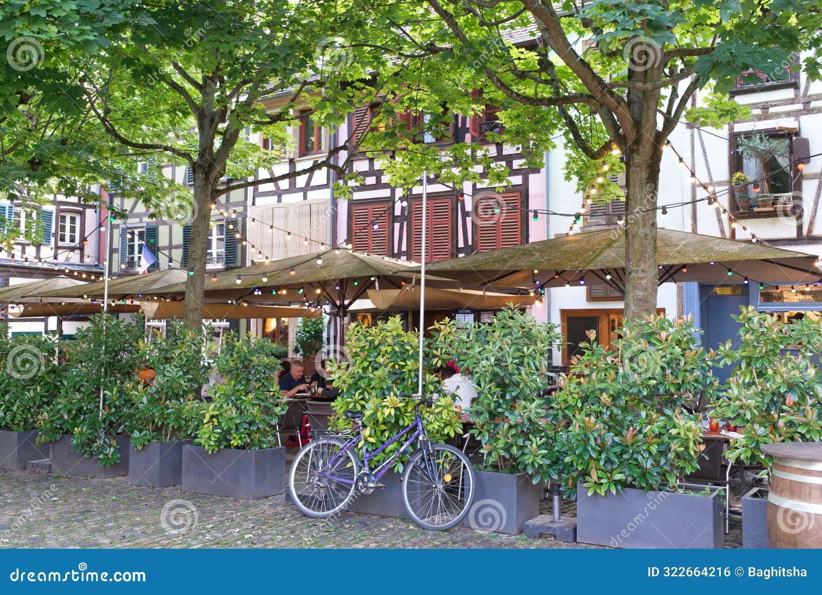 Strasbourg, France. Local Restaurant With Sitting People In Old ...