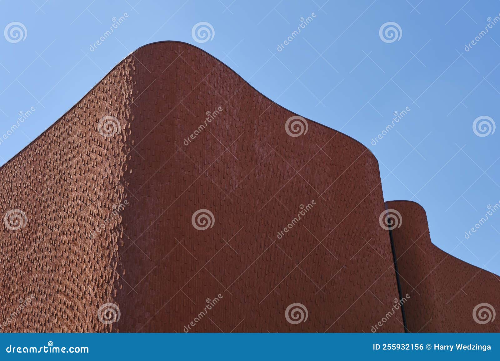 Red Brown Wavy Brick Wall of a Modern Building Stock Photo - Image of ...