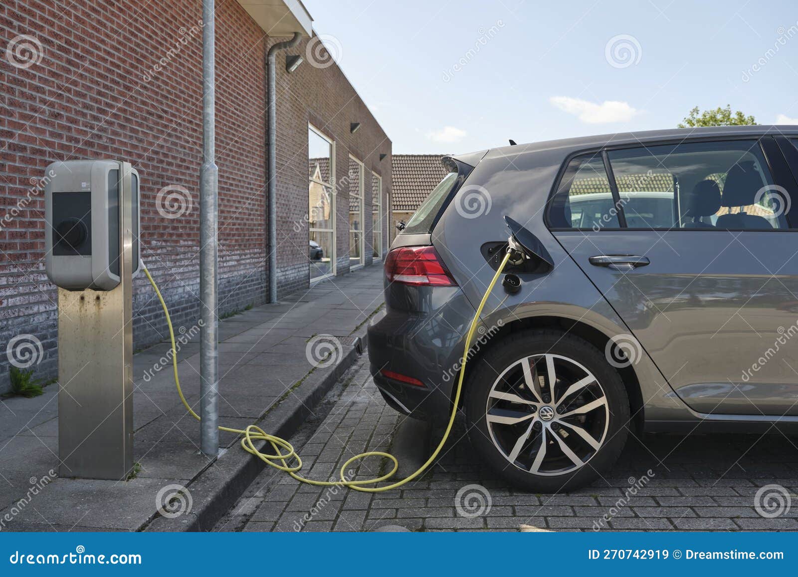 Electric Volkswagen Golf Car Charging at a Charging Point Editorial ...