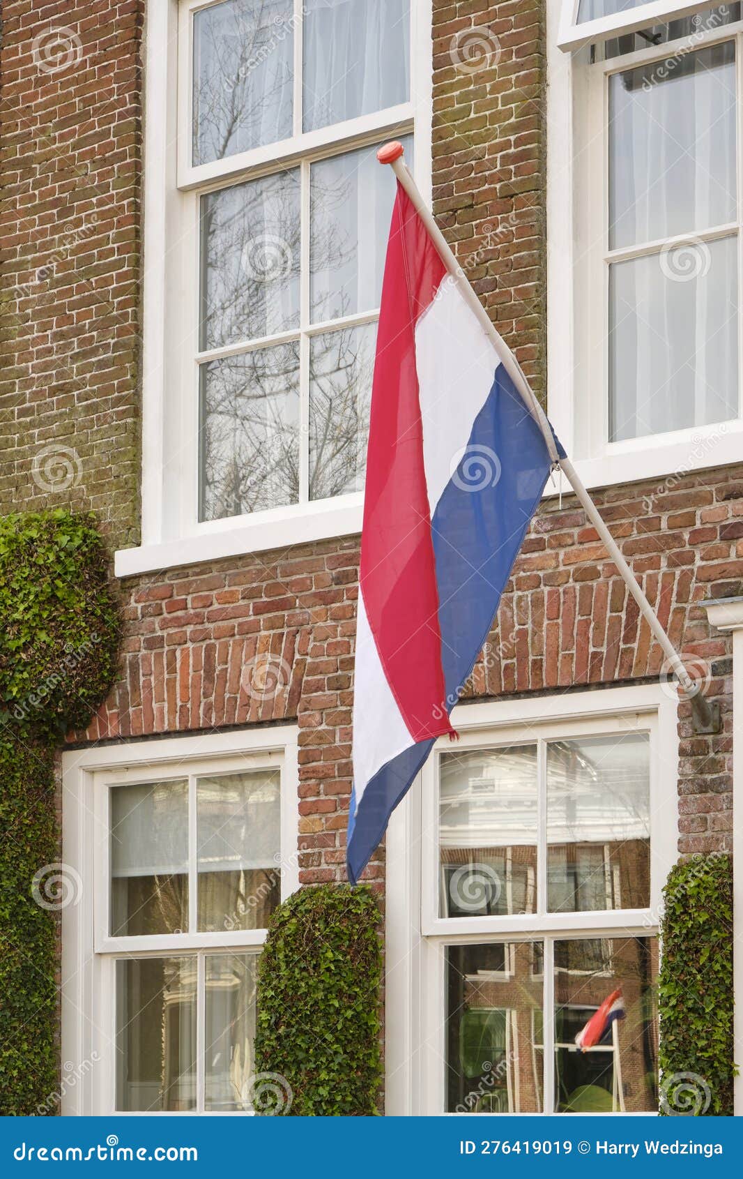 Dutch Flags Waving in a Dutch Street on Koningsdag Stock Image - Image ...