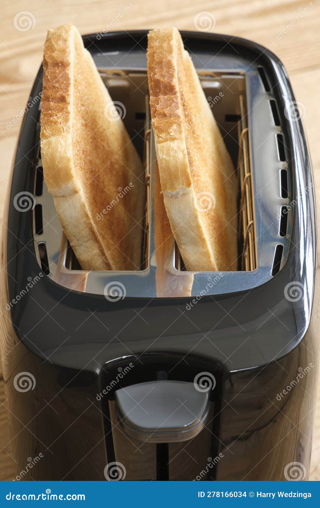 A Black Shiny Toaster with Brown Toasted Bread Stock Photo - Image of ...