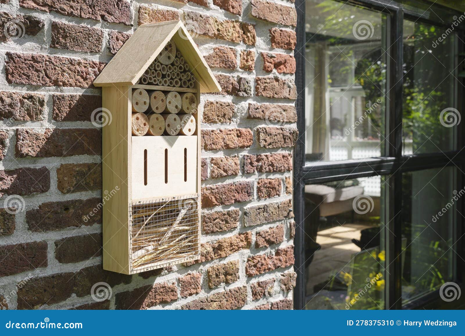 An Insect Hotel or Bee Hotel on the Facade of a House Stock Photo ...