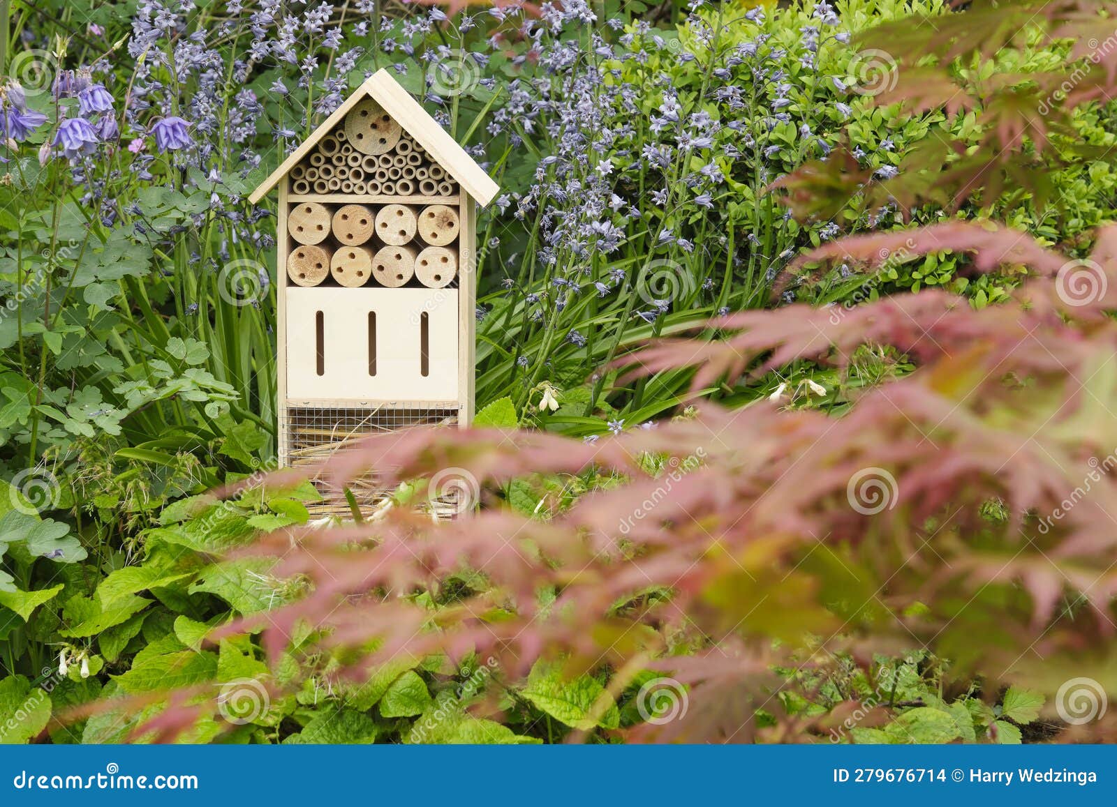 An Insect Hotel or Bee Hotel in a Summer Garden Stock Photo - Image of ...