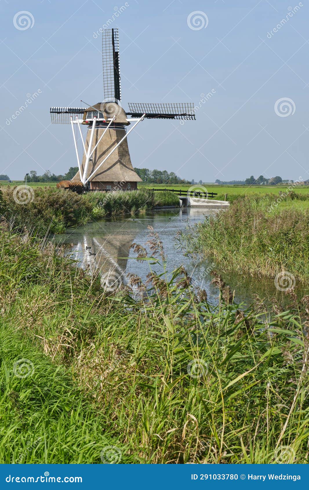 View on a Traditional Thatched Dutch Windmill in Hantum Stock Photo ...