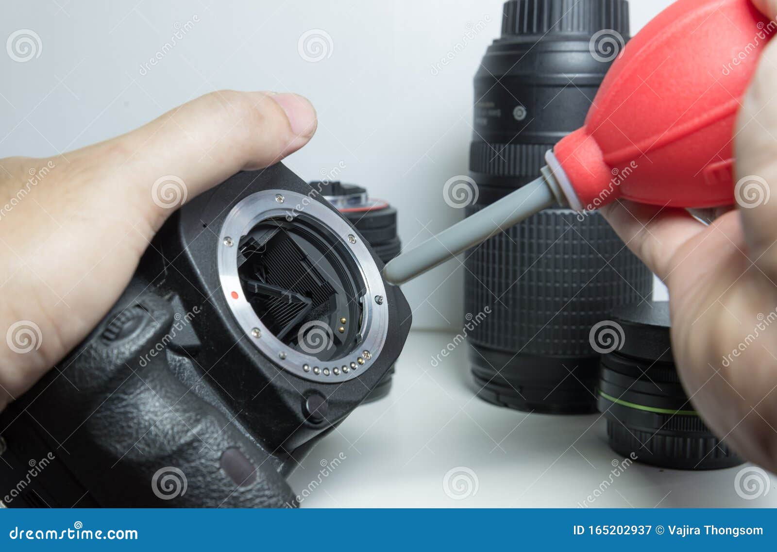 DSLR Camera Lens Cleaning by Blowing Dust of the Image Sensor Stock ...
