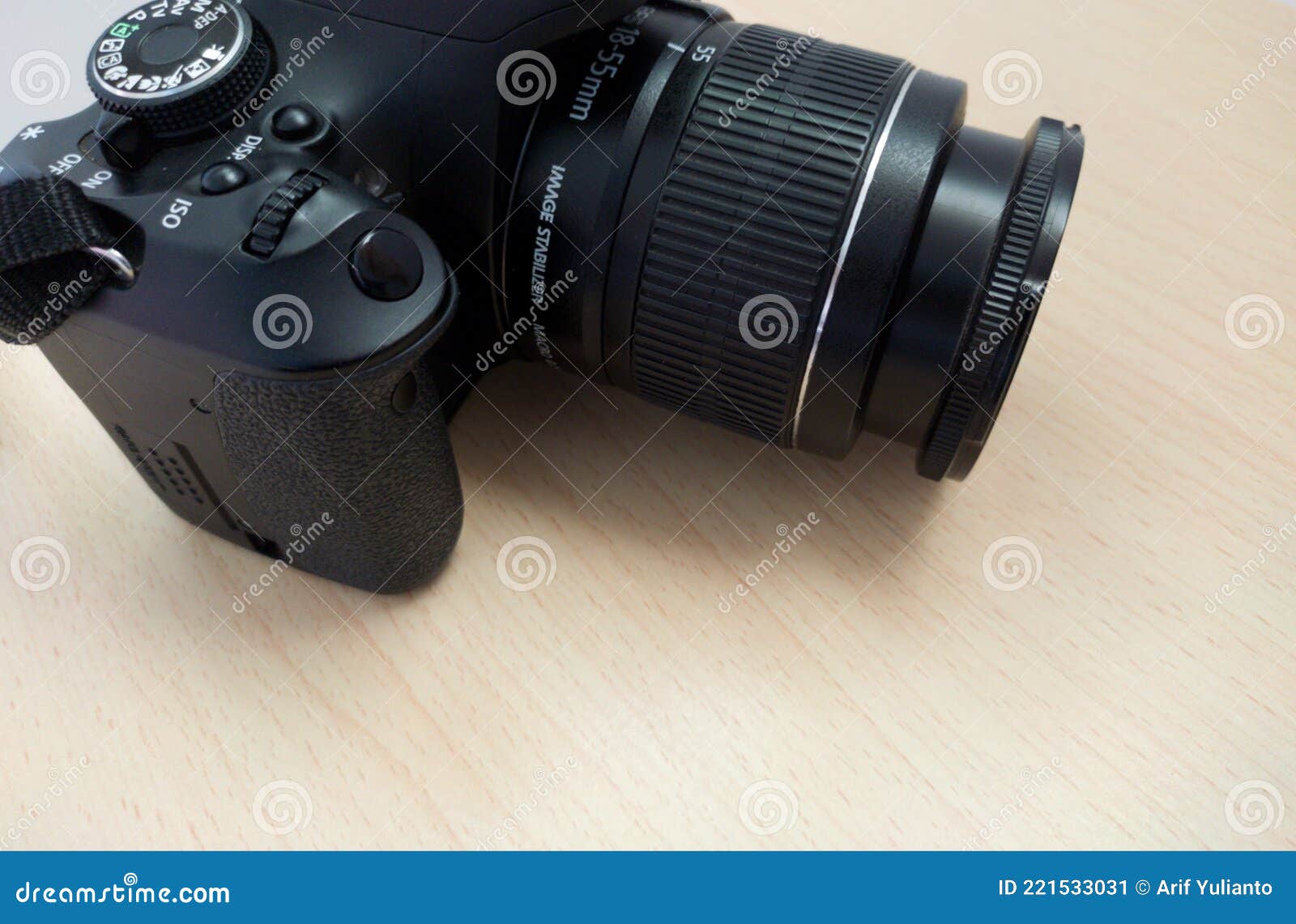DSLR camera on wood table stock image. Image of glass - 221533031
