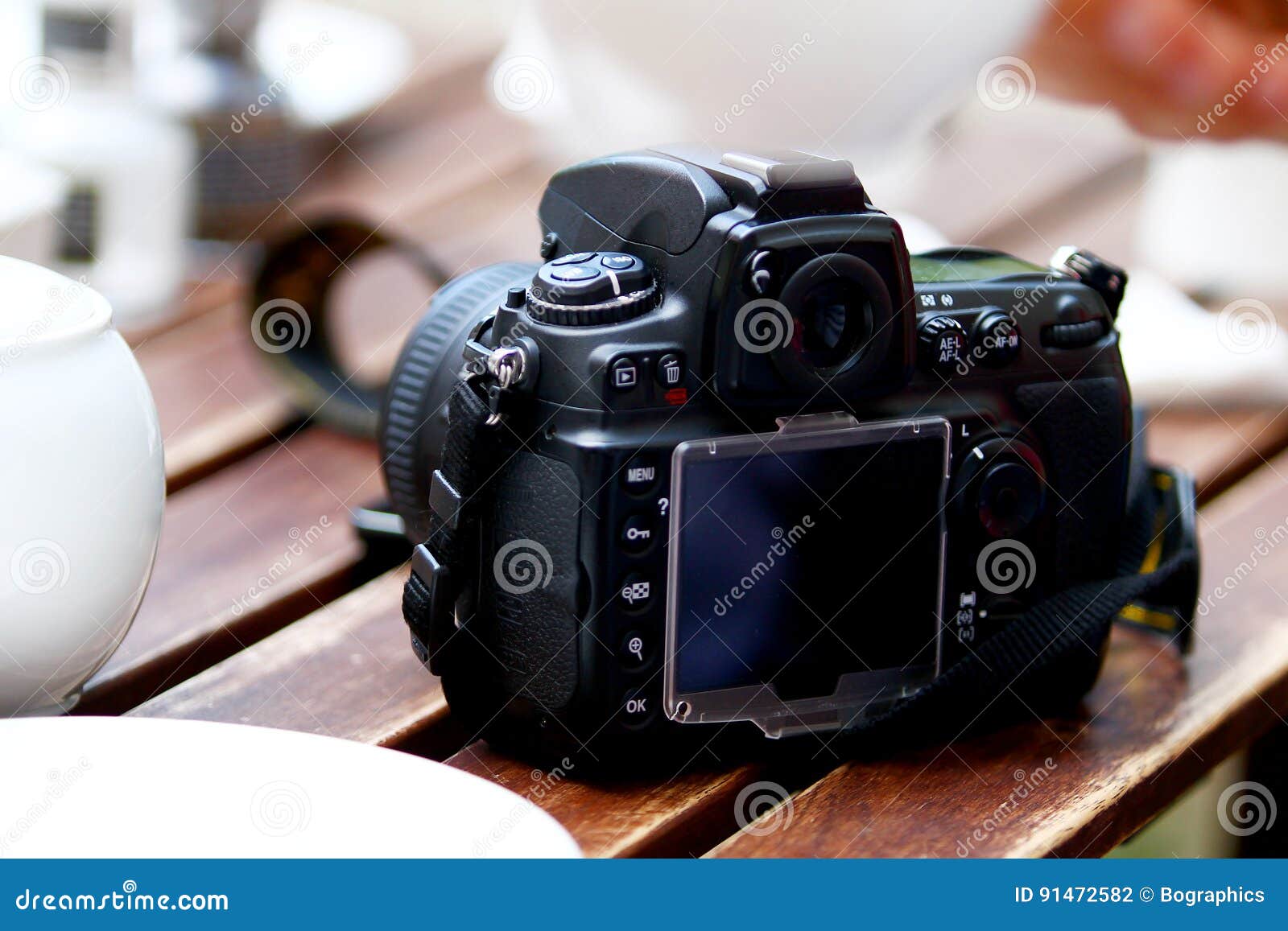 DSLR Photo Camera Standing on Table Stock Photo - Image of photographer ...