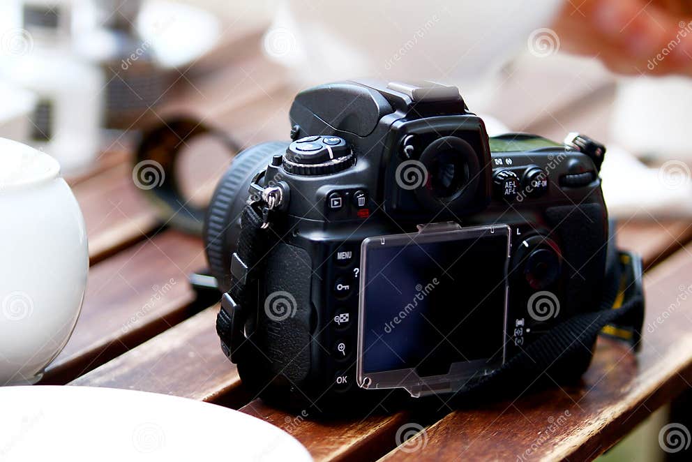 DSLR Photo Camera Standing on Table Stock Photo - Image of photographer ...
