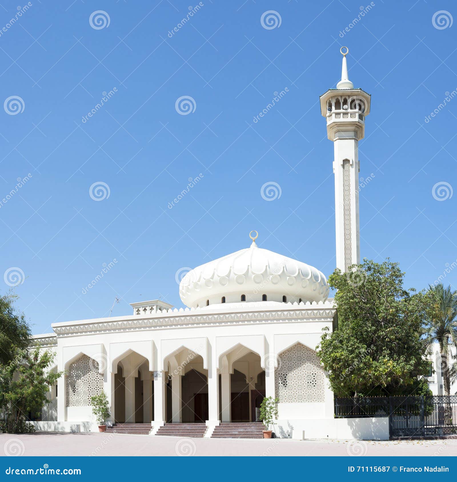 Minaret Of A Muslim Islamic Mosque On The Background Of The Blue Sky ...