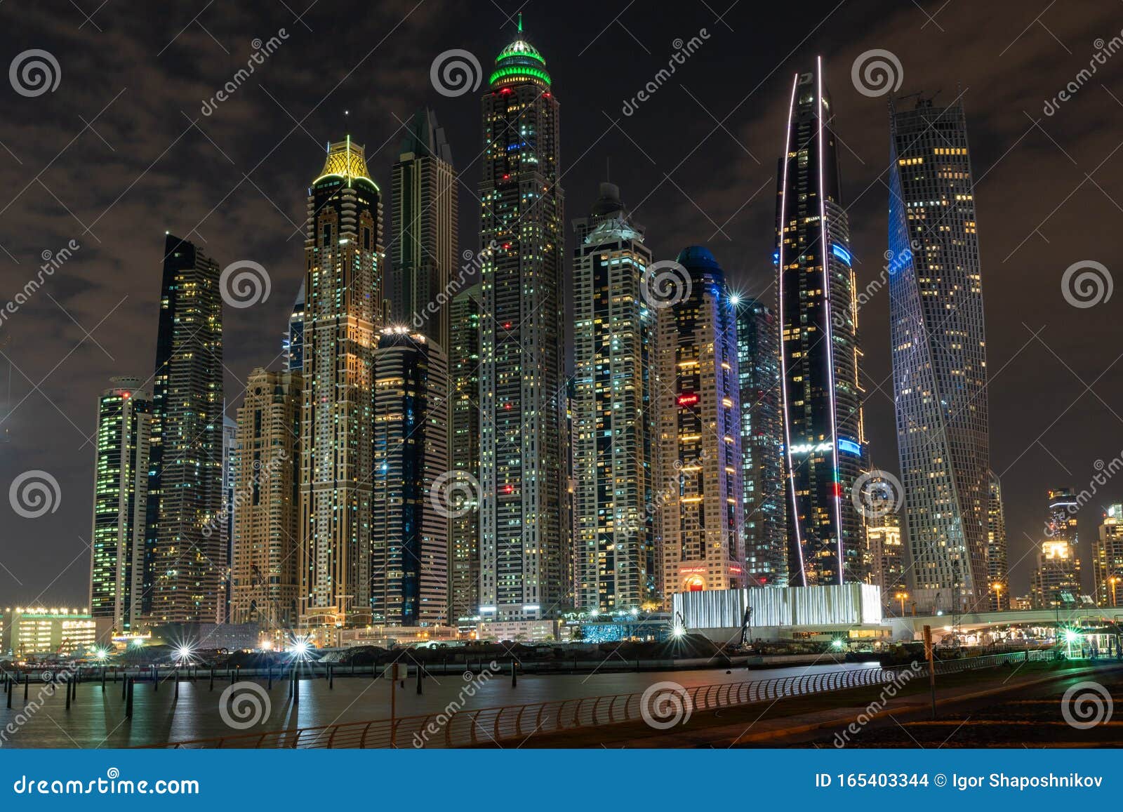 Dubai Skyline at Night with Colorful Reflections on the Water Stock ...