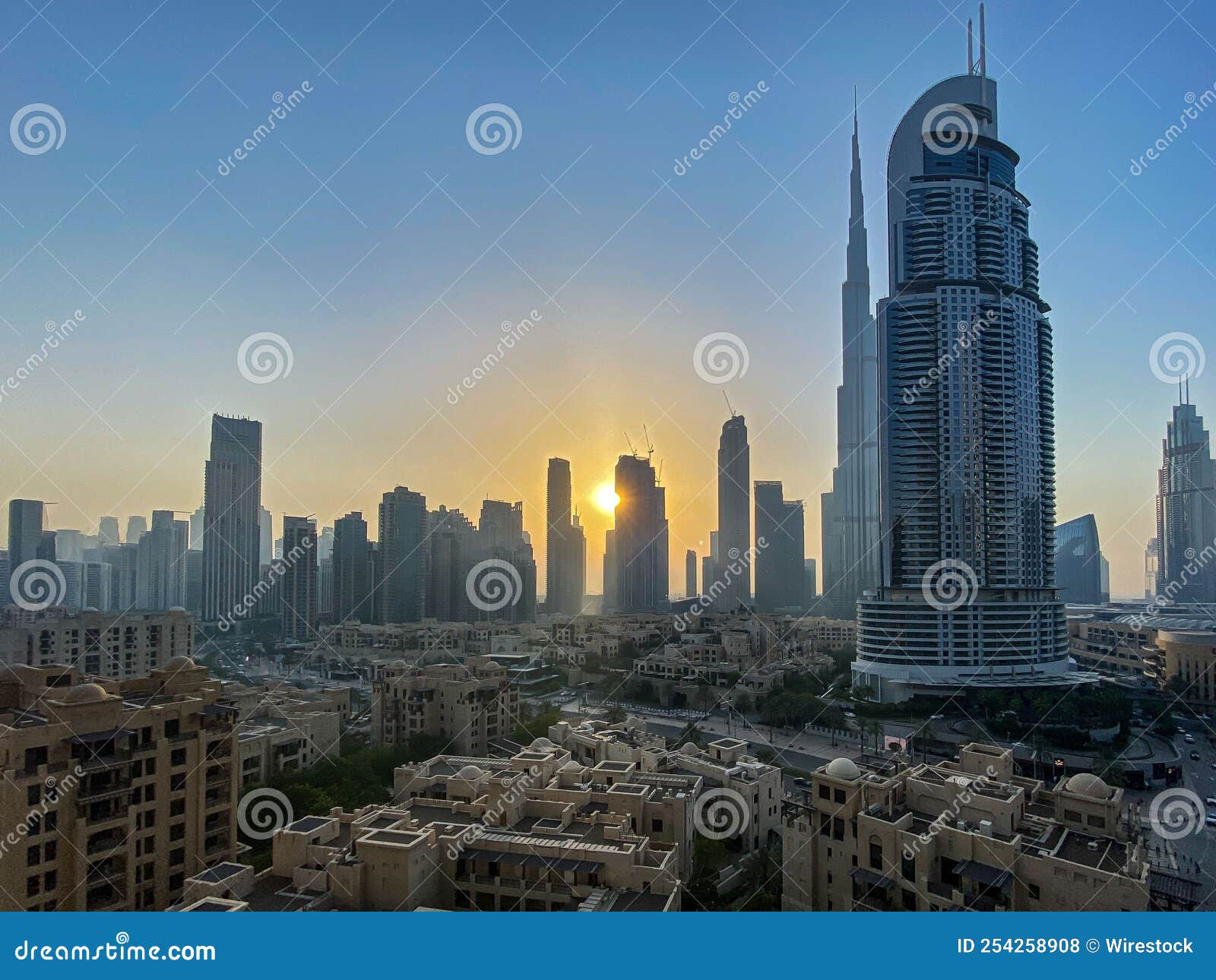 Dubai skyline at sunset stock photo. Image of architecture - 254258908