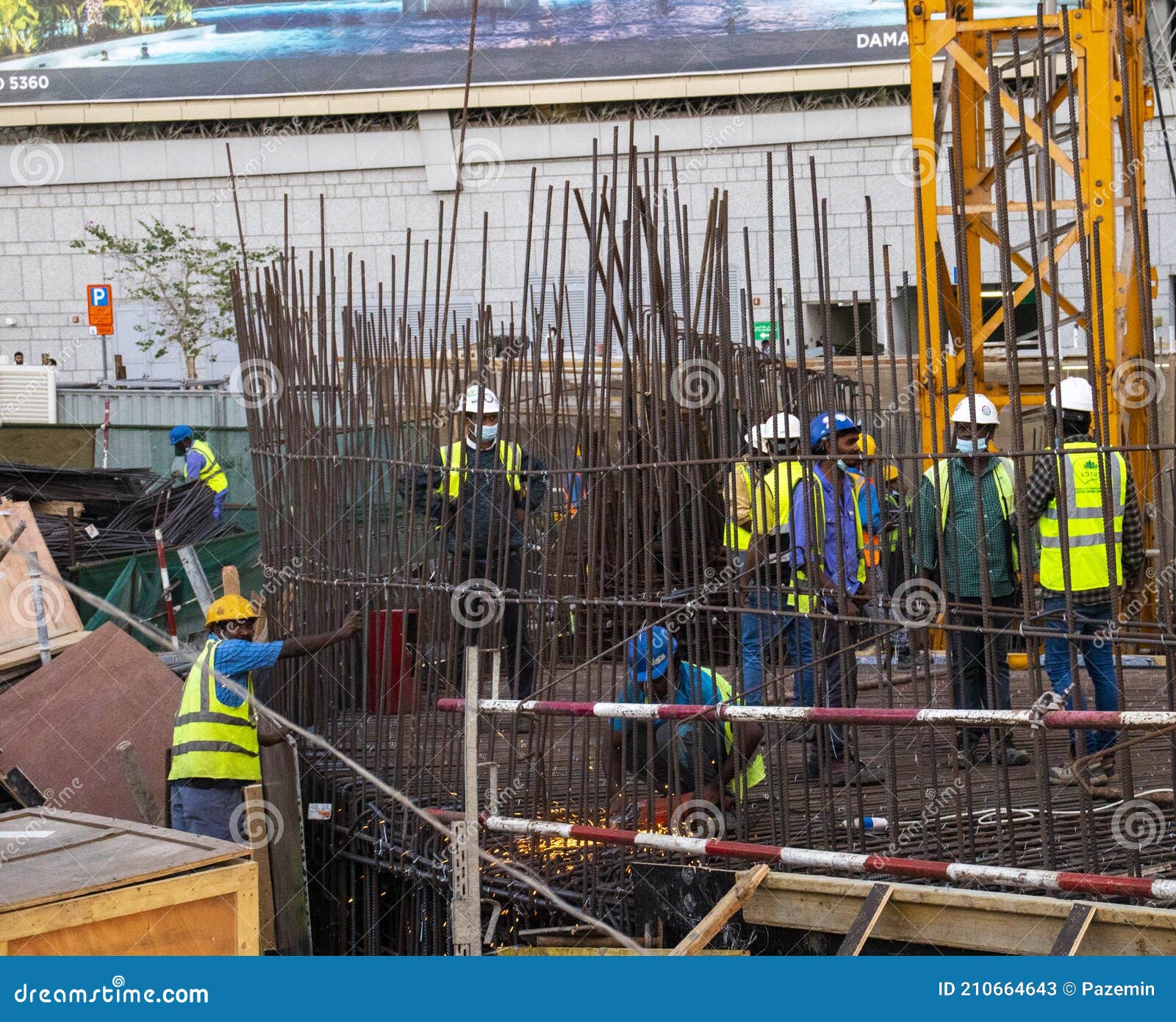 Dubai,UAE - 02.14.2021 Construction Workers on Site. Industrial ...