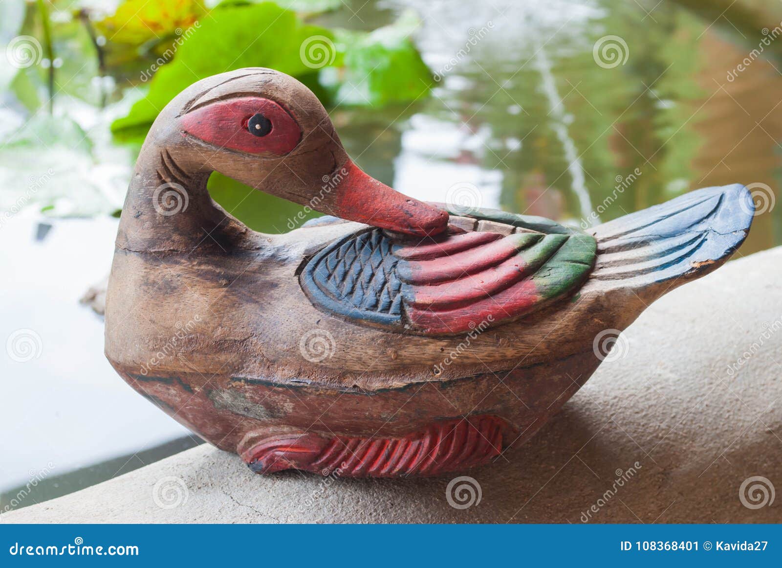 Duck Statue Made from Wood Standing in a Pool Stock Image - Image of ...