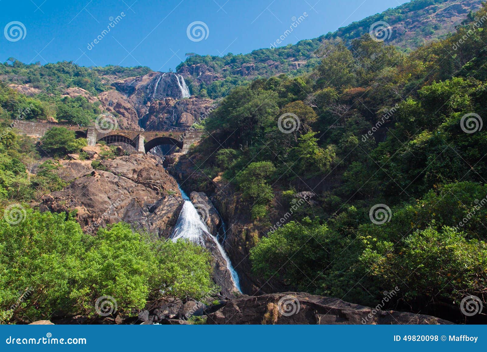 Dudhsagar Waterfall stock photo. Image of blue, rocks - 49820098