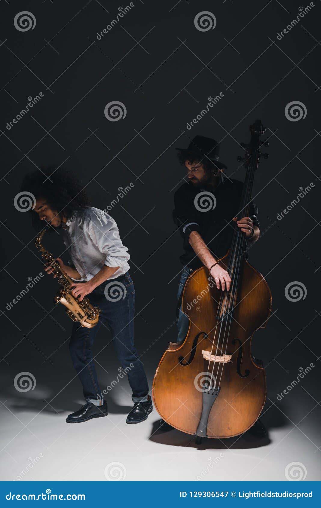 Duet of Jazzmen Playing Trumpet and Saxophone Stock Image - Image of ...