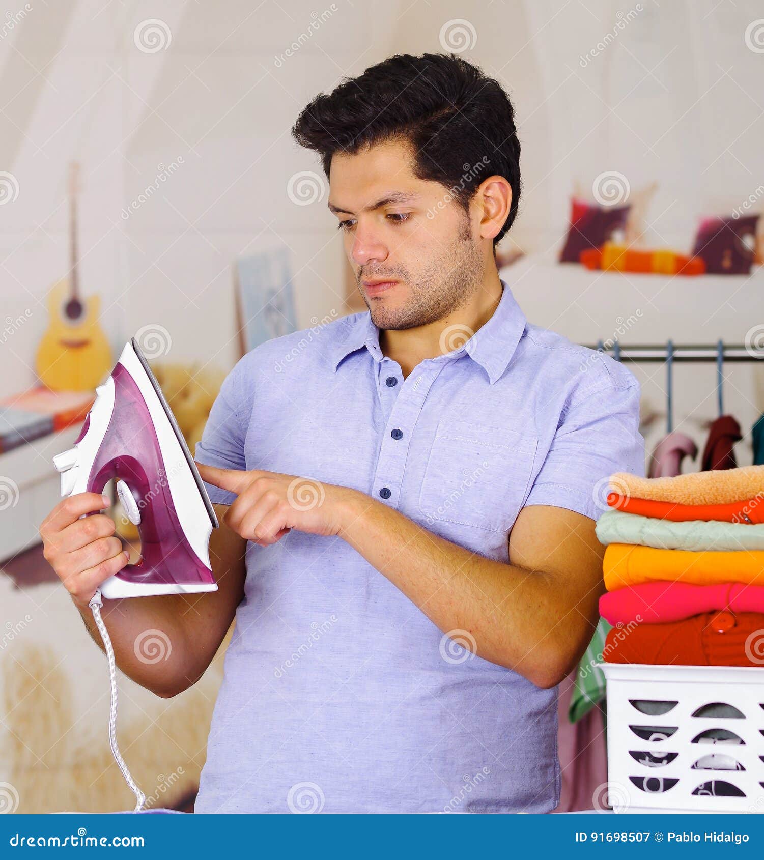 Dumb Cute Young Man Touching an Iron Stock Image - Image of chores ...