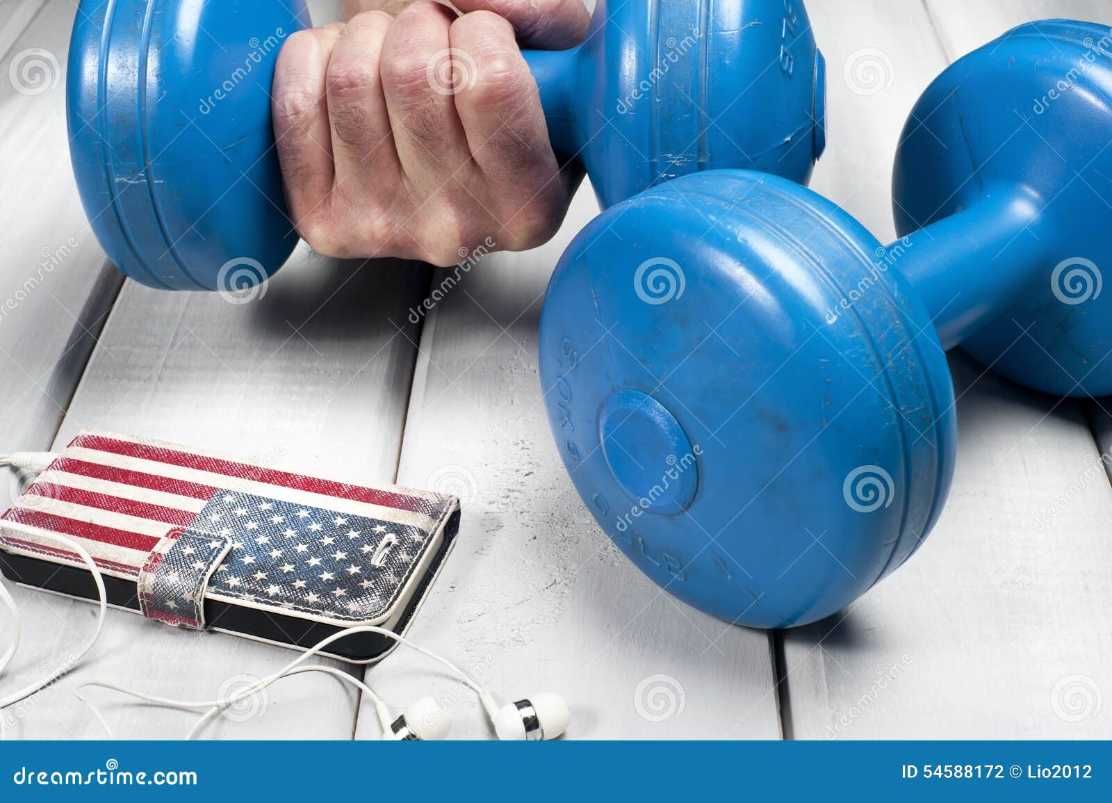 Dumbbells and Smartphone on Floor Stock Photo - Image of dumbbell, fist ...