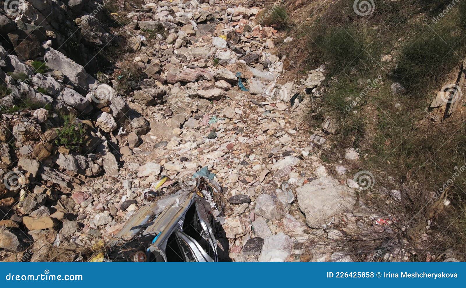 Dump with Garbage and Broken Car on the Rocks among Cliffs, View from ...