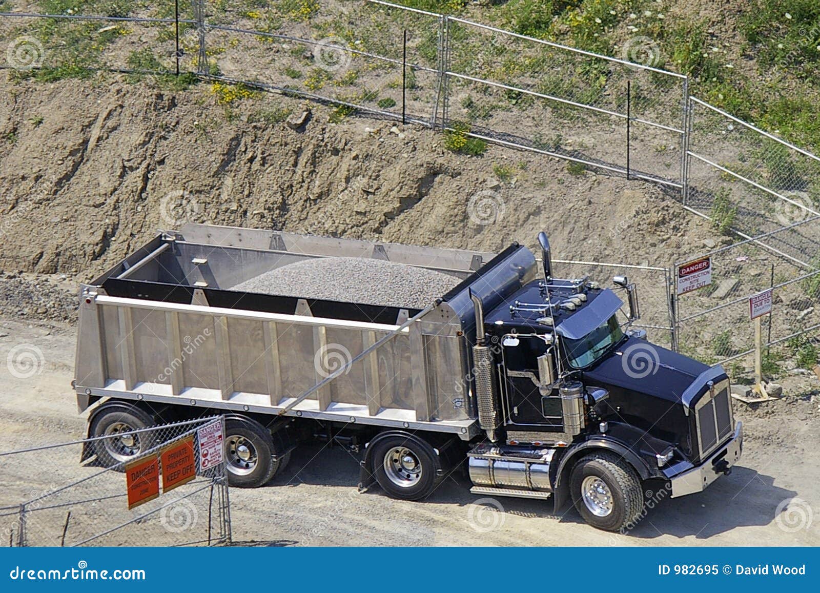 Dump Truck Backing in To Construction Site Stock Image - Image of ...