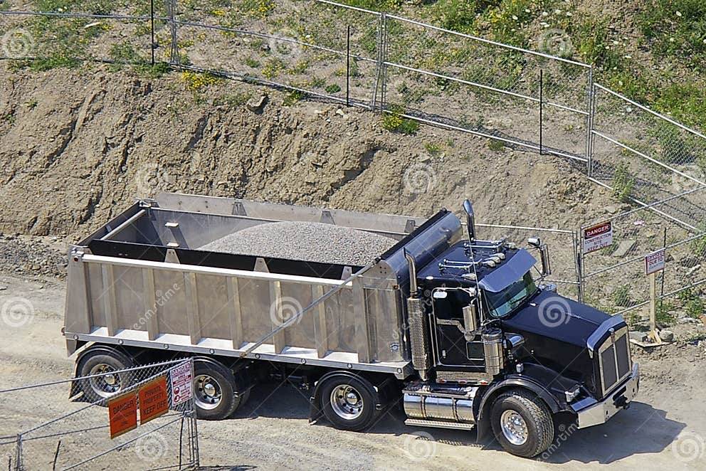 Dump Truck Backing in To Construction Site Stock Image - Image of ...