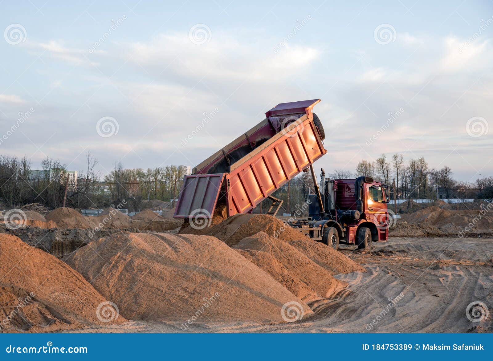 Dump Truck Unloading Earth Sand for Road Construction or for Foundation ...