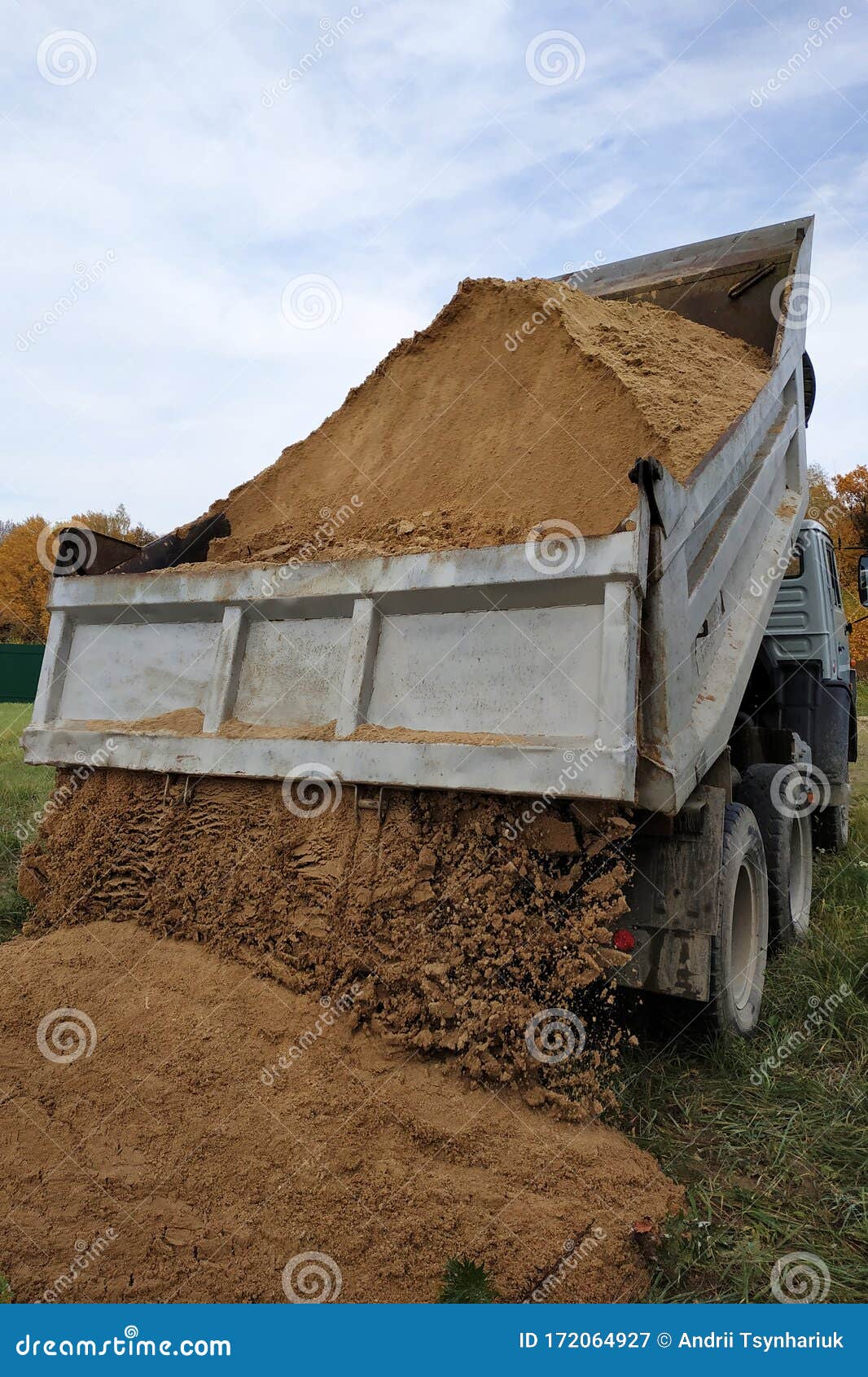 A Dump Truck Unloads Sand in the Construction Site Stock Image - Image ...