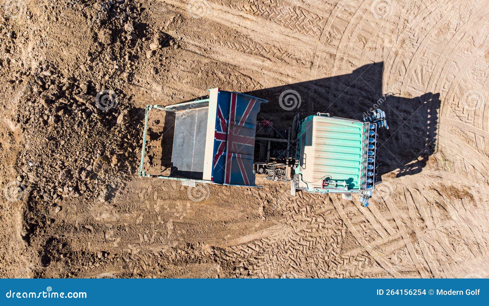 Dump Truck Unloads Soil on the Construction Site. Aerial View Stock ...