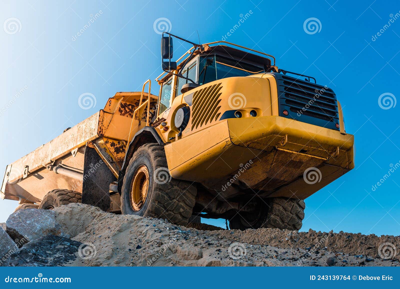 Dumper Transporting Large Rocks To Reinforce a Stock Photo - Image of ...