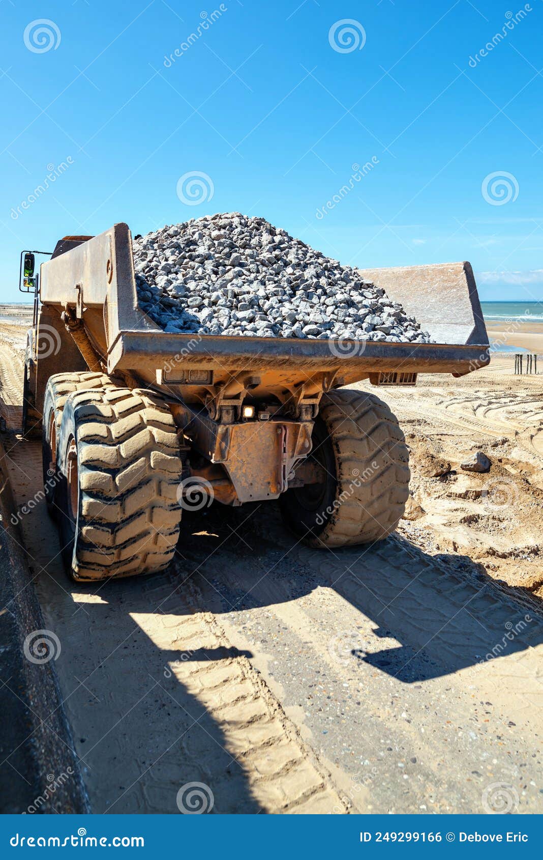 Dumper Unloading Its Cargo on a Construction Site Stock Photo - Image ...