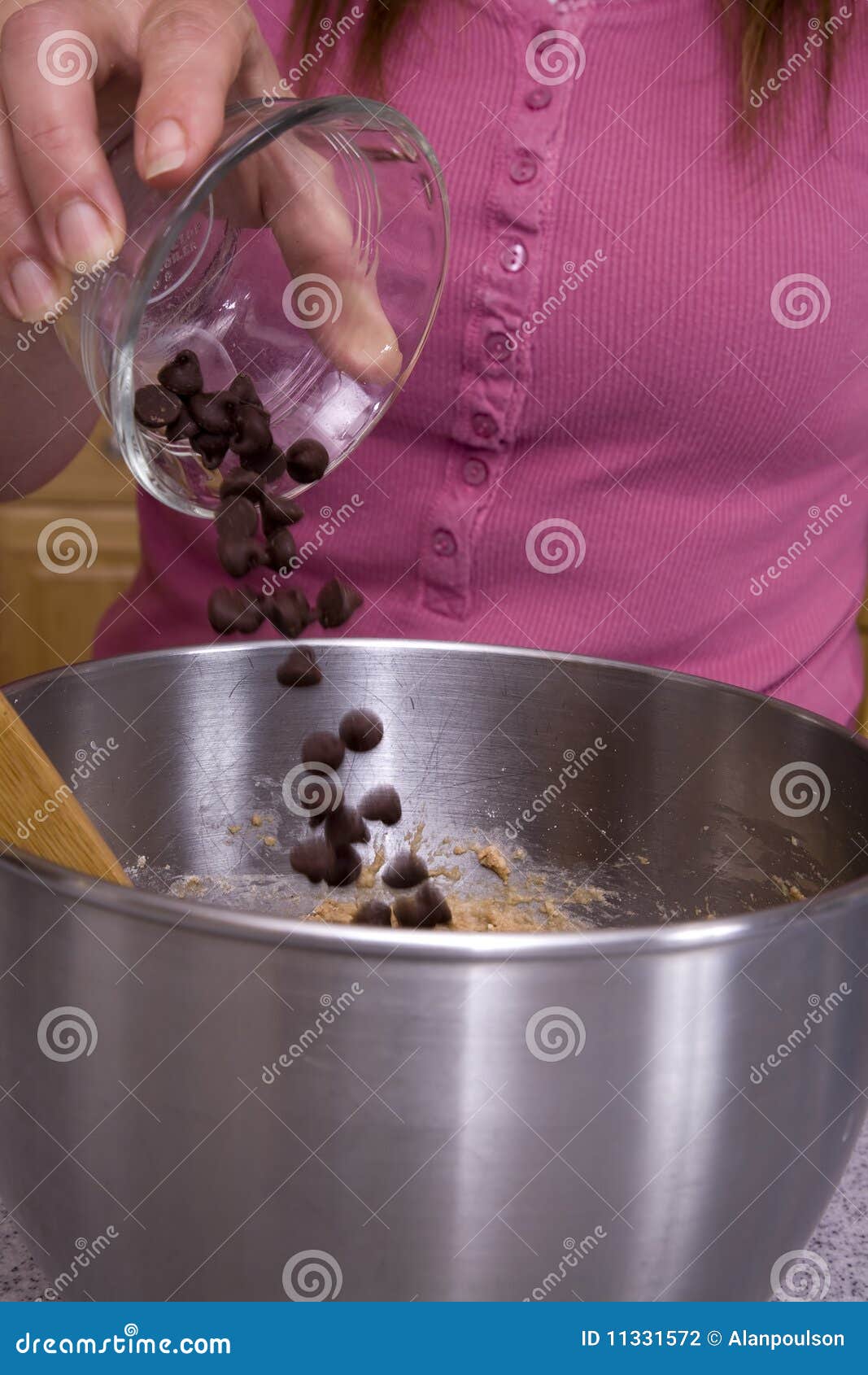 Dumping Chocolate Chips in Cookies Stock Photo - Image of fingers ...