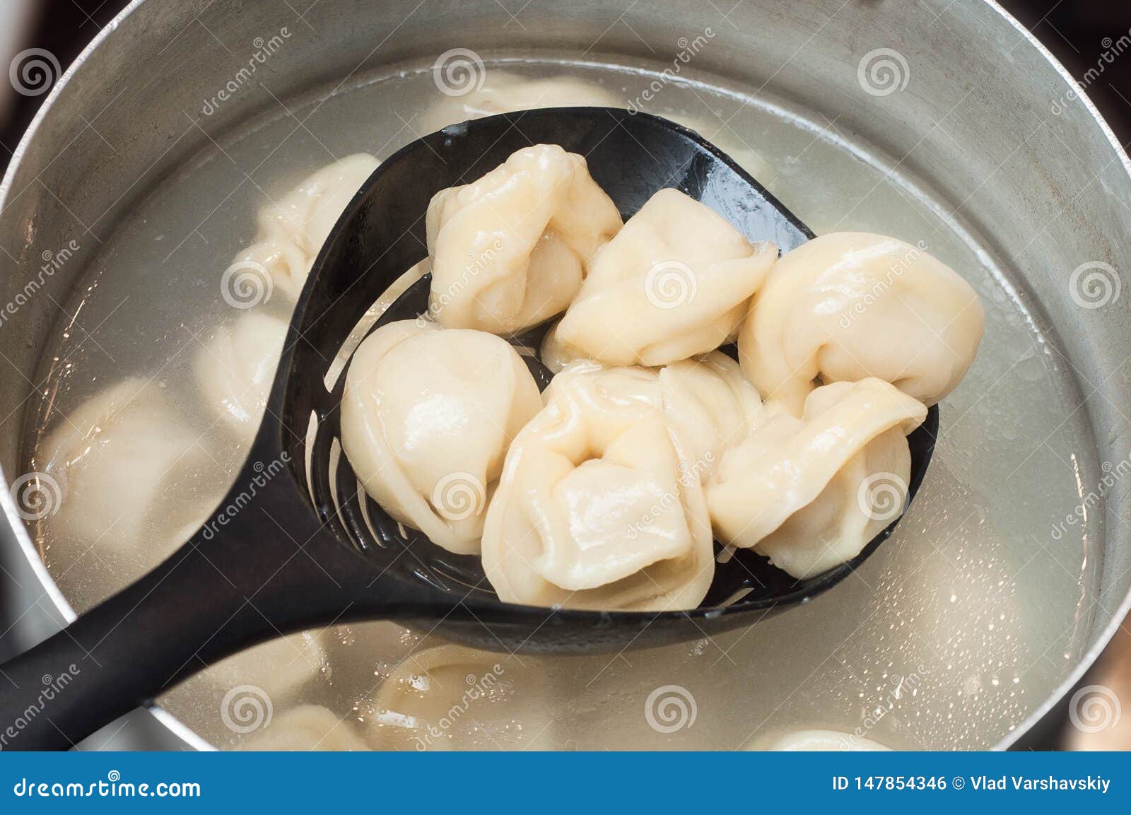 Dumpling Ravioli on a Strainer for Filtering from Water and Laying on ...