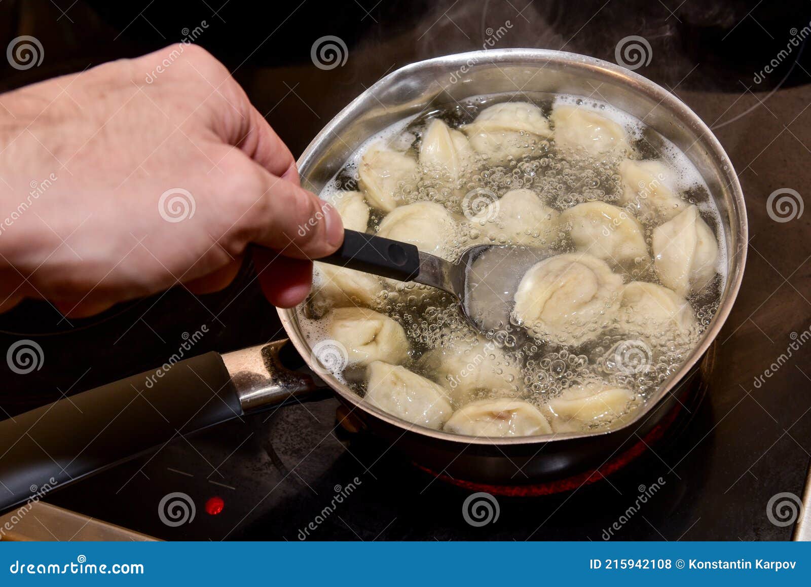 Dumplings in Boiling Water. Meat Dumplings are Boiled in a Pot of ...