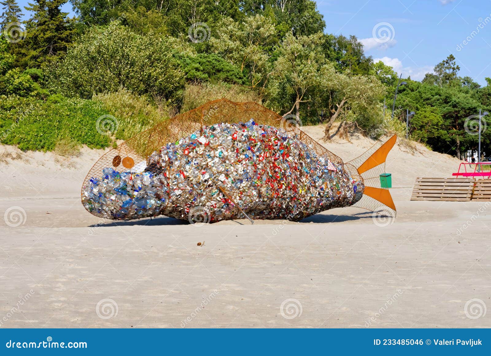 Dumpster in the Form of a Huge Fish with Garbage Inside. Stock Photo ...