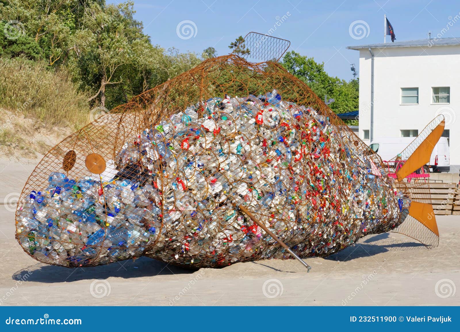 Dumpster in the Form of a Huge Fish with Garbage Inside. Editorial ...